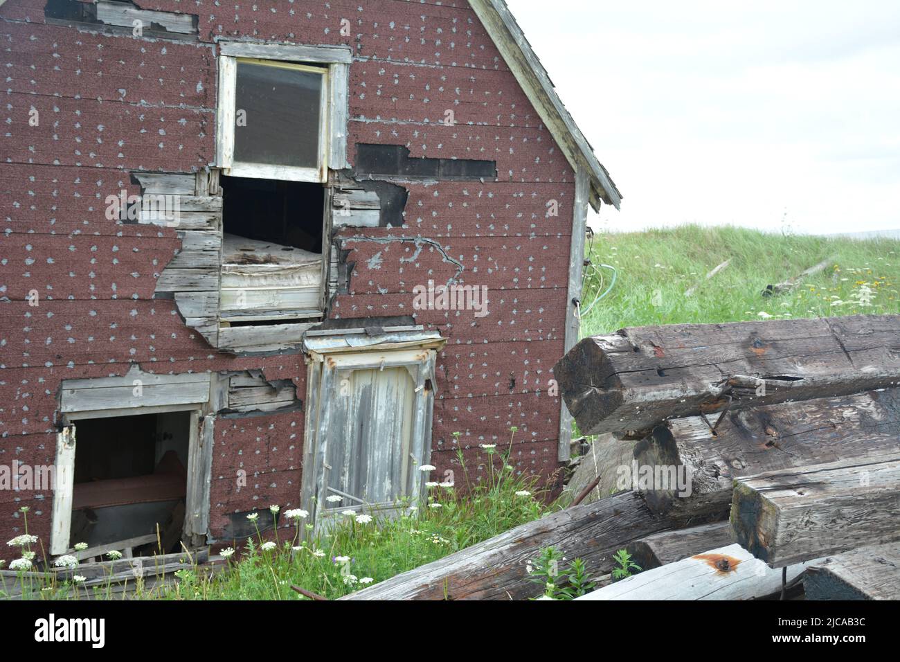 Window and yellow siding at old seaside building Stock Photo - Alamy