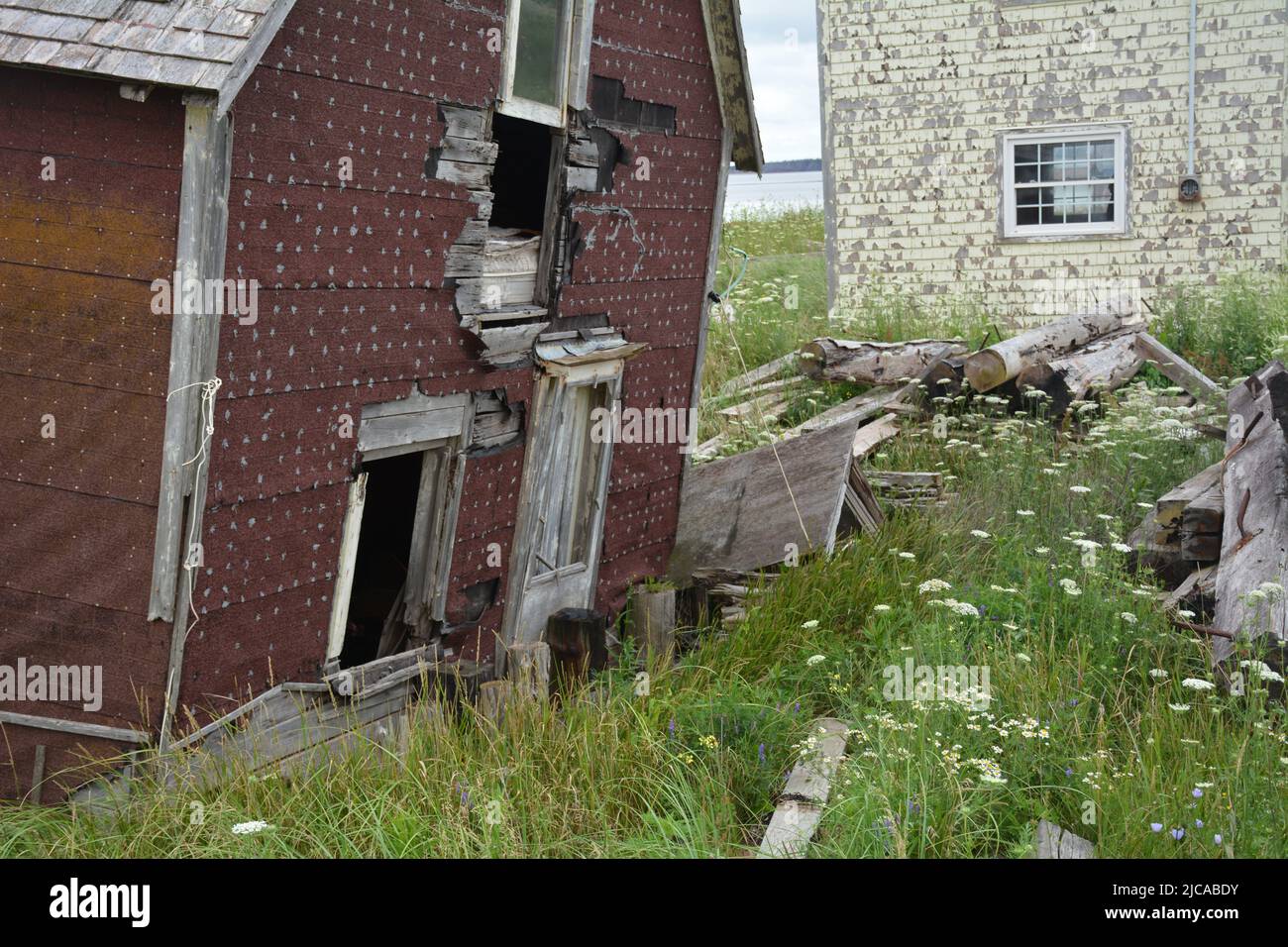 Window and yellow siding at old seaside building Stock Photo - Alamy