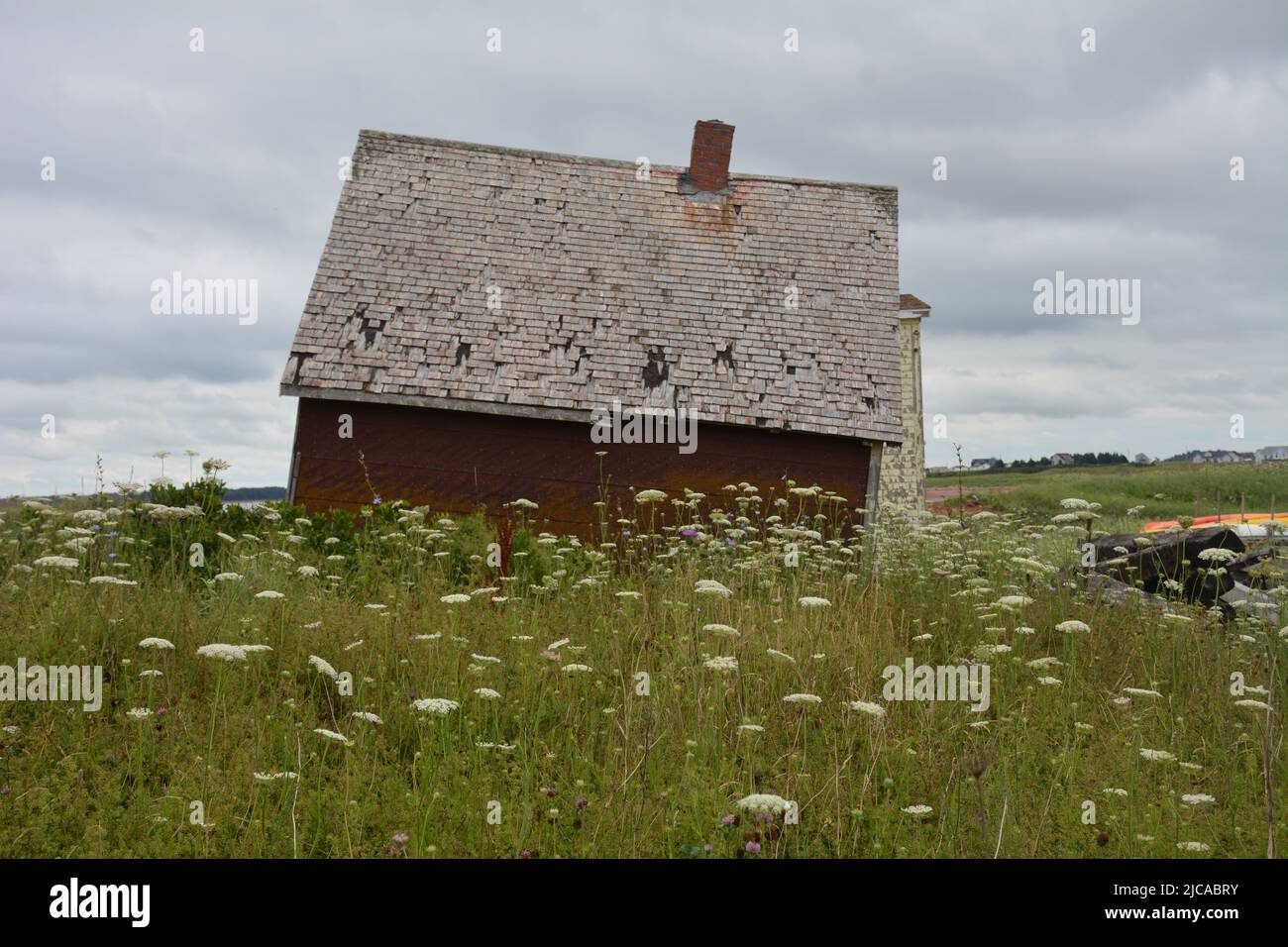 Window and yellow siding at old seaside building Stock Photo - Alamy