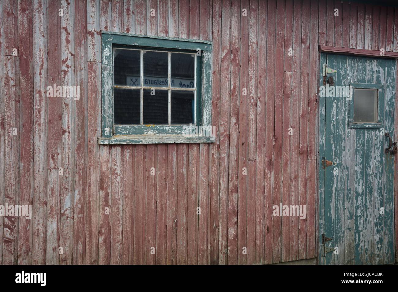 Window and yellow siding at old seaside building Stock Photo - Alamy