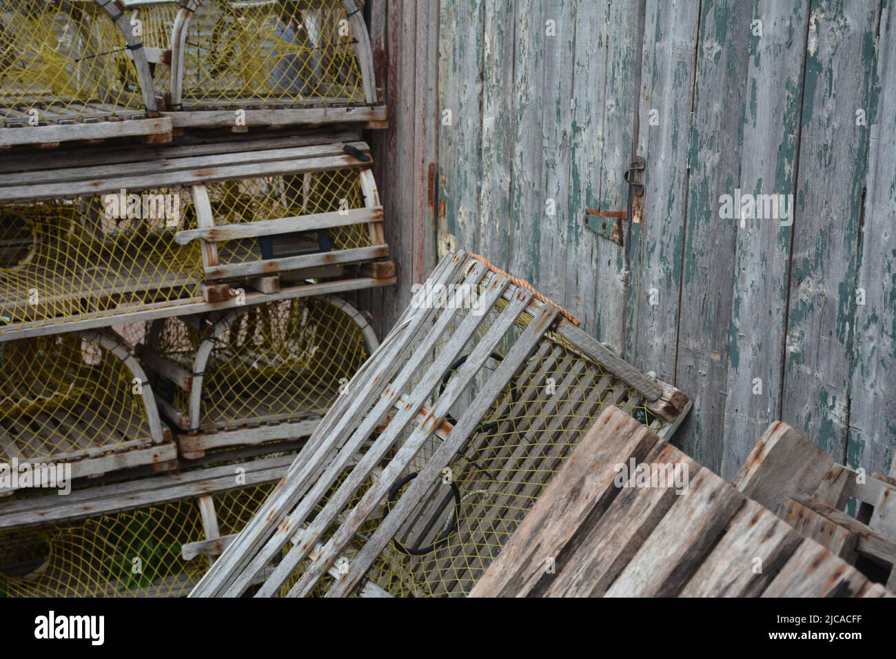 Window and yellow siding at old seaside building Stock Photo - Alamy