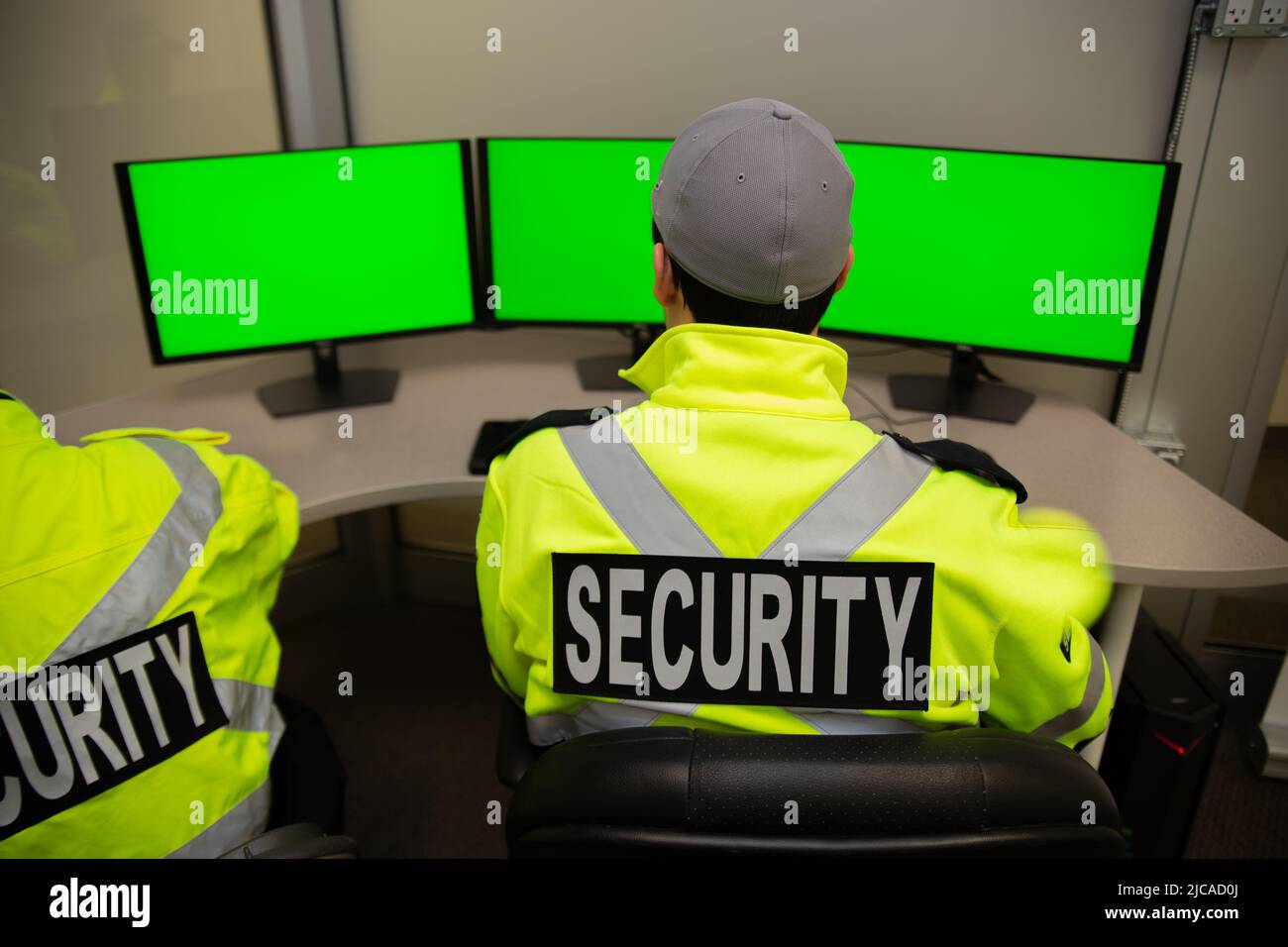 Security team watching over CCTV surveillance monitors Stock Photo - Alamy