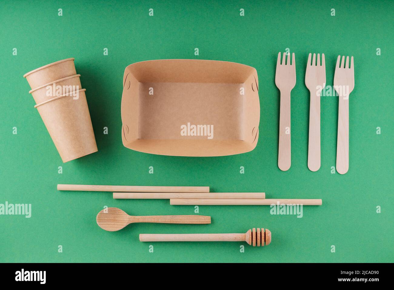 Eco-friendly tableware, paper disposable cup and wooden cutlery on a ...