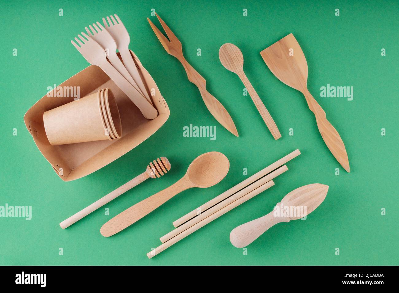 Eco-friendly tableware, paper disposable cup and wooden cutlery on a ...