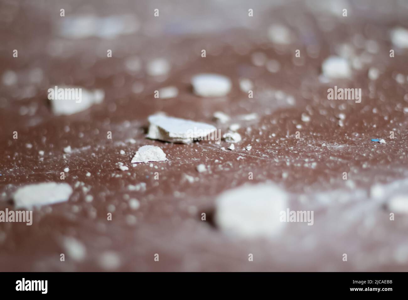 Defocus ruined rubble on brown background. Building debris close-up ...