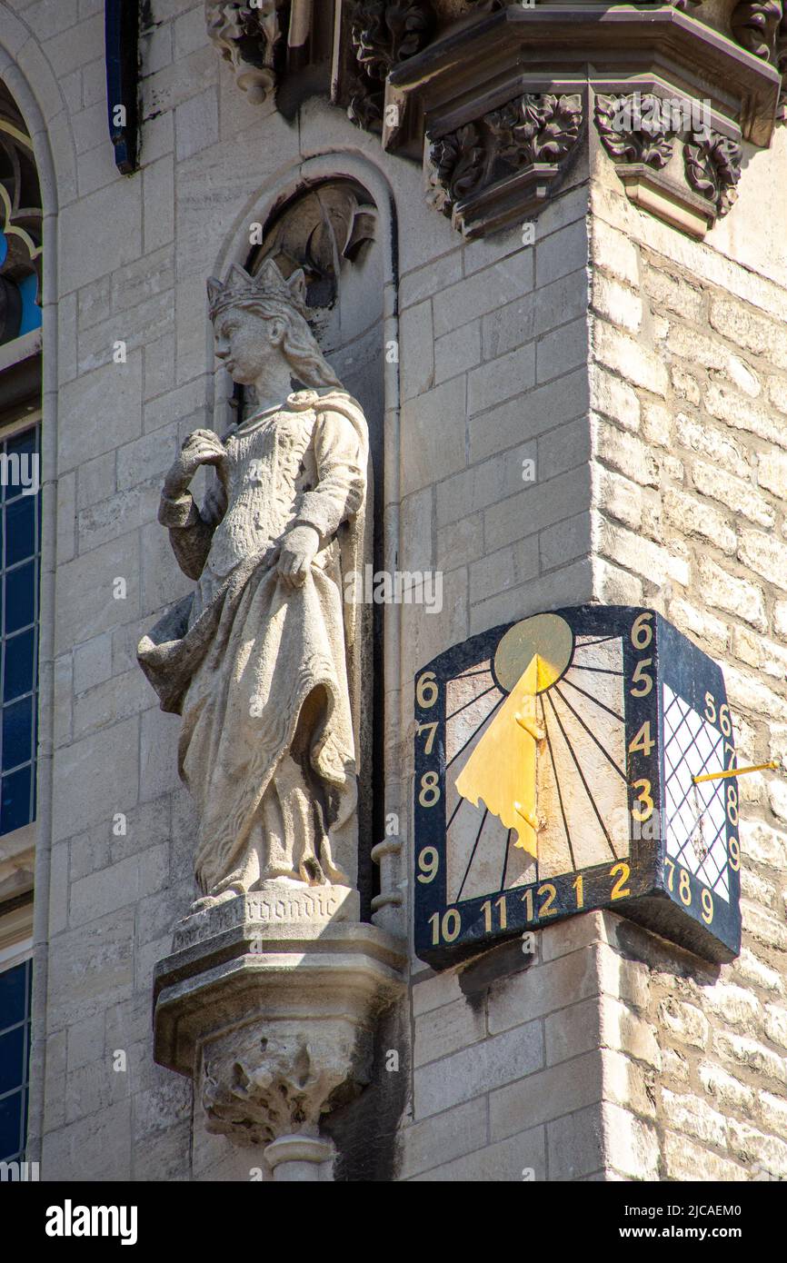 Sundial and statue on side of building in Gouda, Netherlands Stock ...