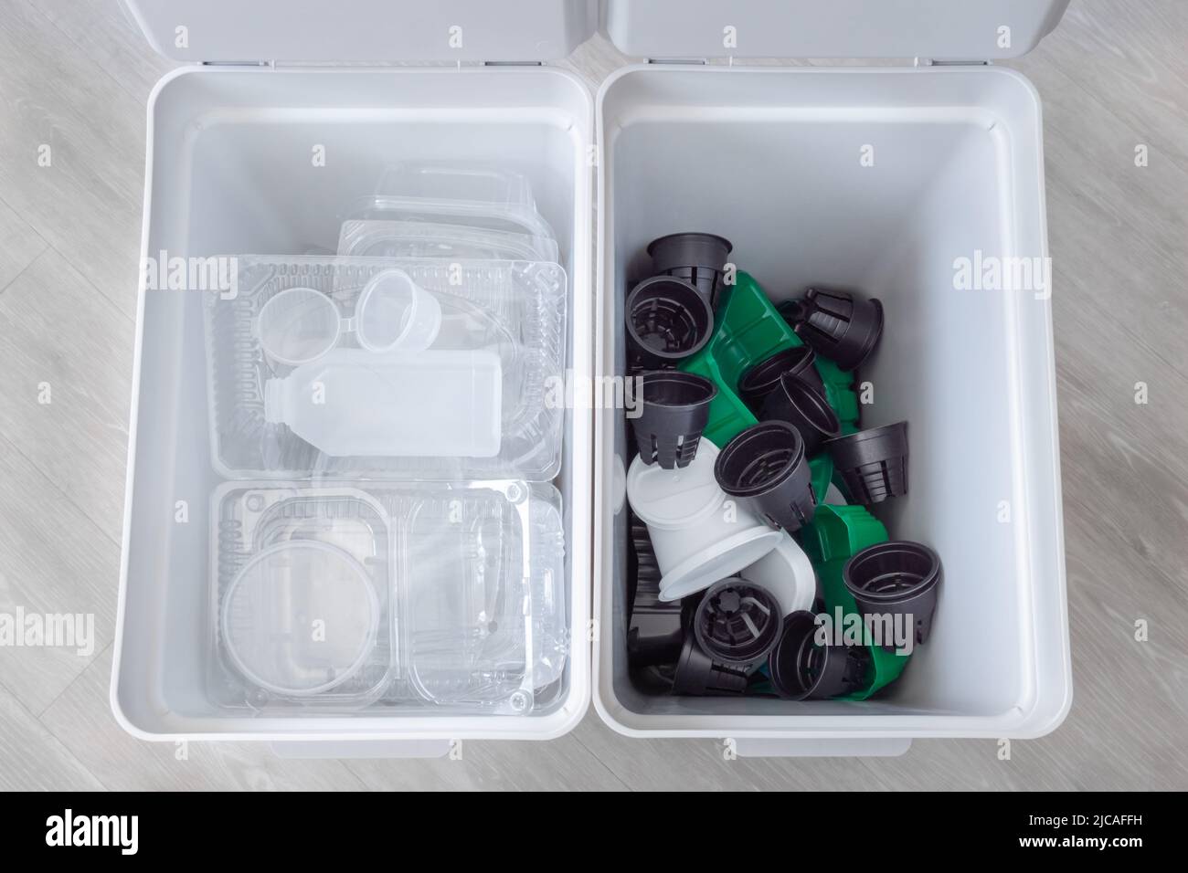 Sorting of garbage in two recycling bins, garbage baskets - top view ...