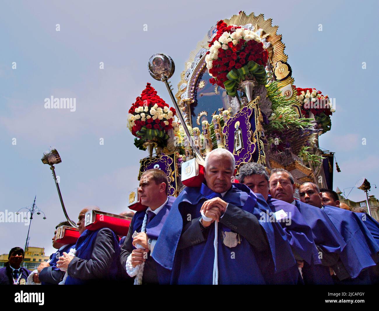 Devotees carrying the religious litter of the Lord of the Miracles ...