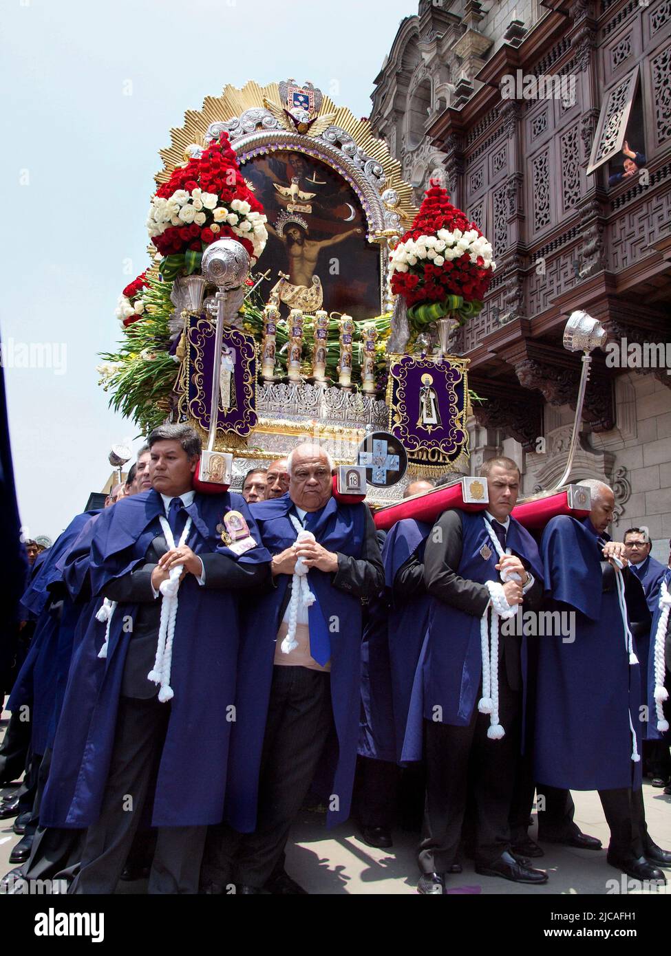 Devotees carrying the religious litter of the Lord of the Miracles ...