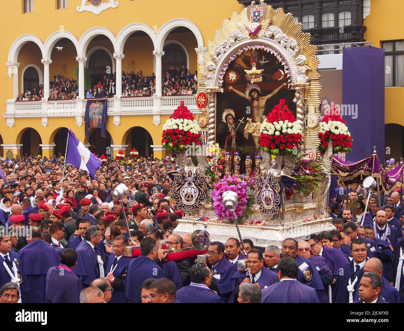 Tens of thousands of devotees in procession carrying on their shoulders ...