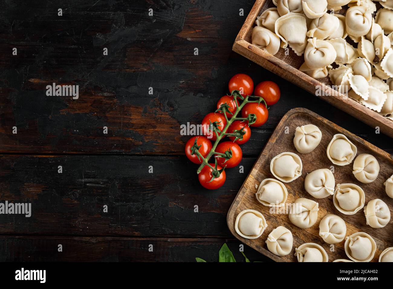 Raw Italian ravioli tortellini with fresh parmesan and basil , tomatoes ...