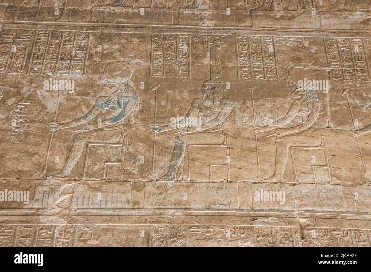 Bas-reliefs of the ancient Temple of Horus in Edfu, Egypt Stock Photo ...