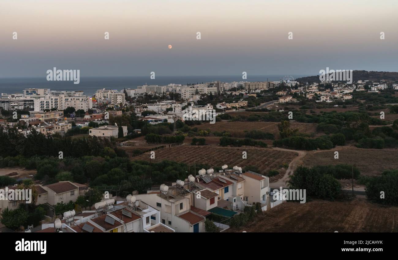 View from the top of the panorama of the evening city of Protaras ...