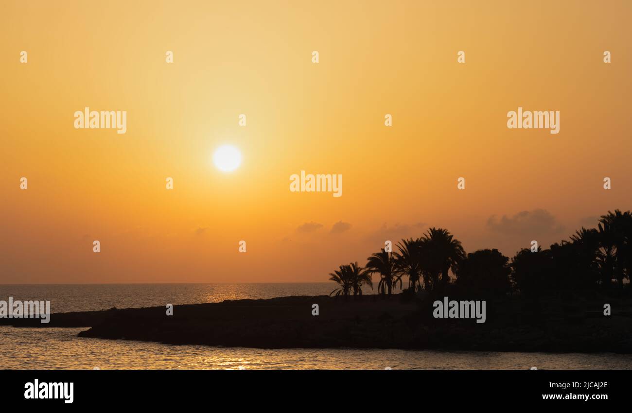 Orange sunrise over the island of Cyprus Stock Photo - Alamy