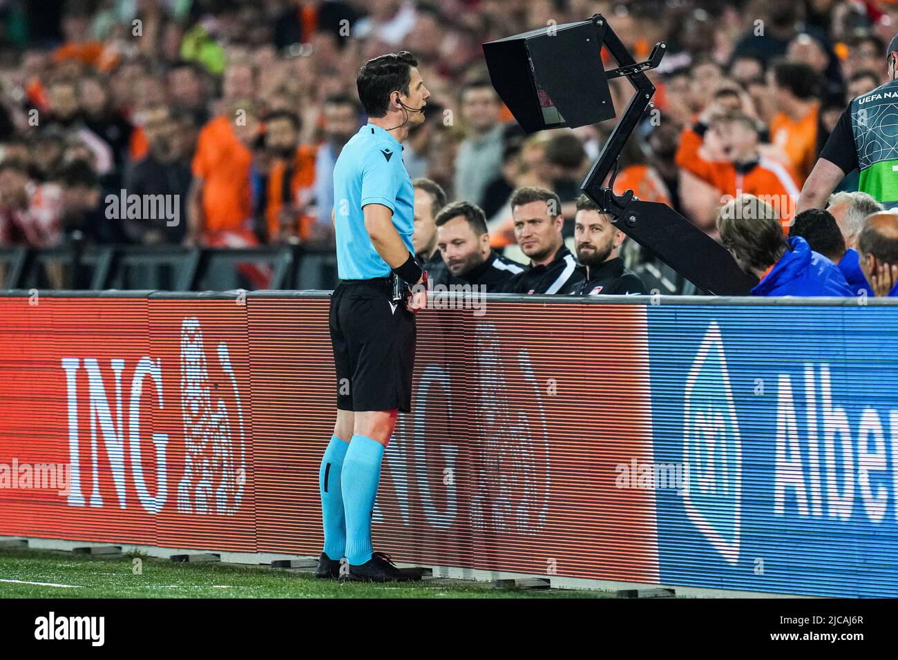 Rotterdam - Referee Halil Umut Meler checks a potential penalty during ...