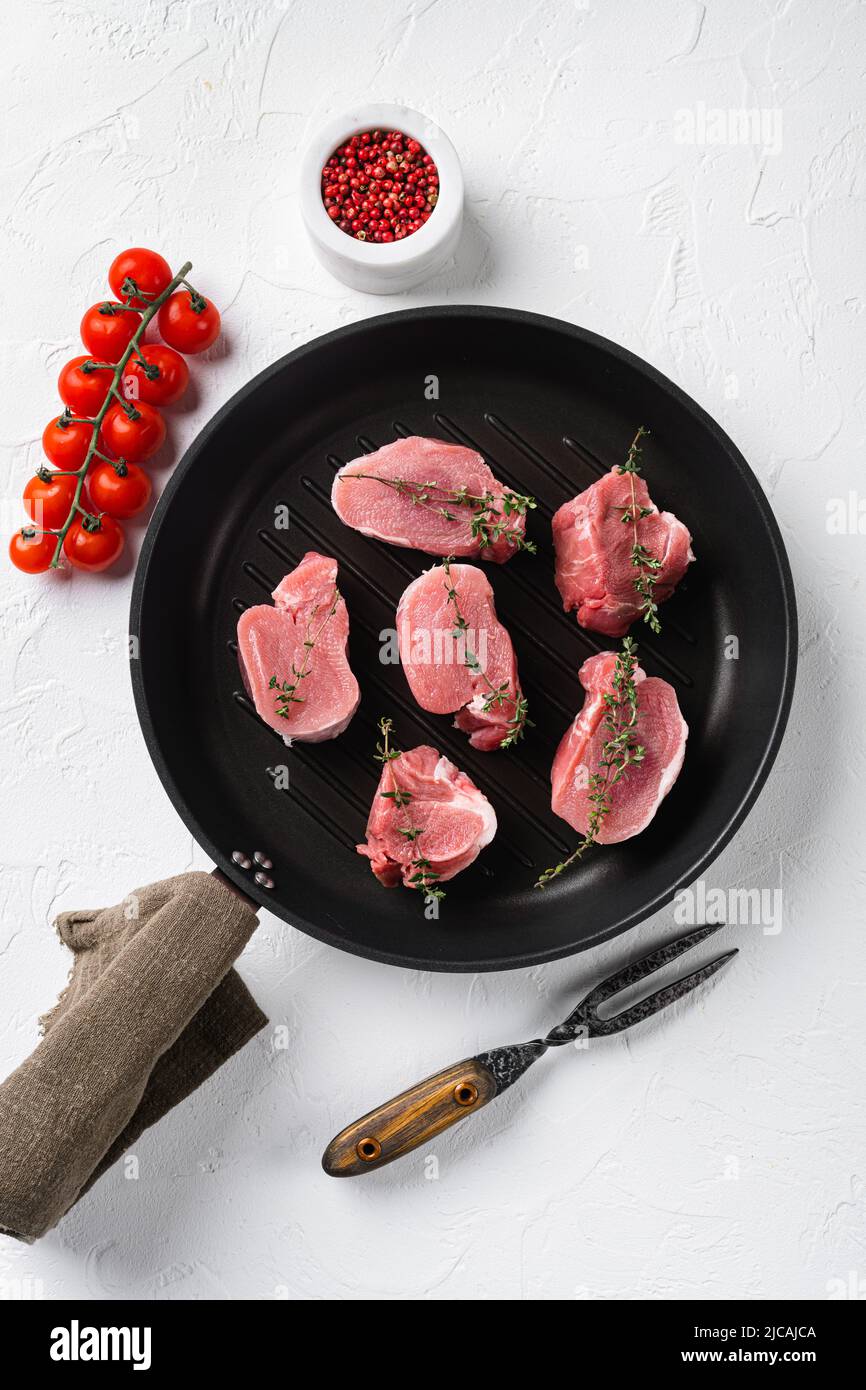 Pork tenderloin. Fresh raw meat prepared for cooking set, on white ...