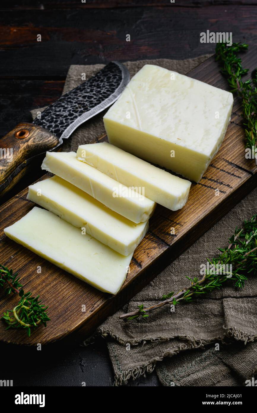 Halloumi Cheese fresh cut set, on old dark wooden table background ...