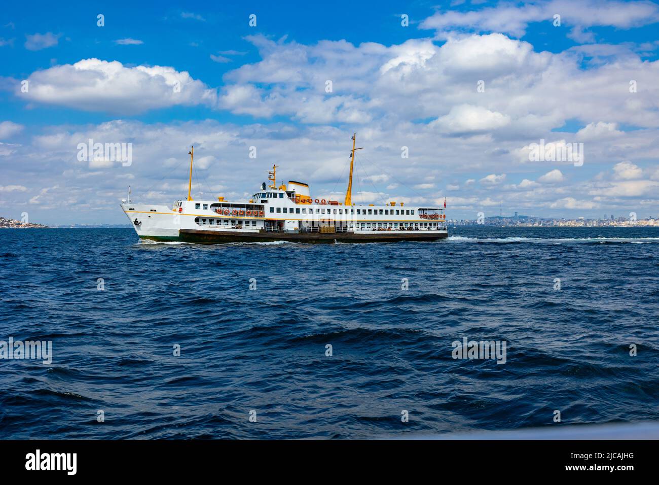 Istanbul's famous ferry. Ferry on the Marmara Sea with cloudy sky ...