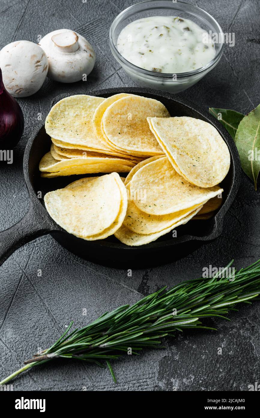 Home made potato chips, on gray stone background Stock Photo - Alamy