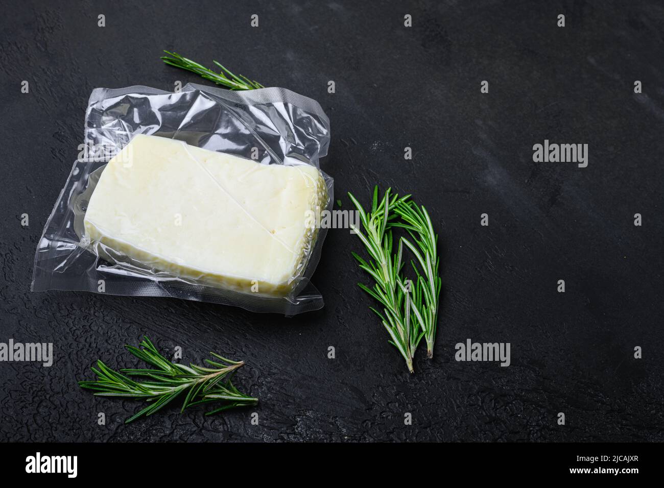 Cyprus Halloumi cheese set, on black dark stone table background, with ...