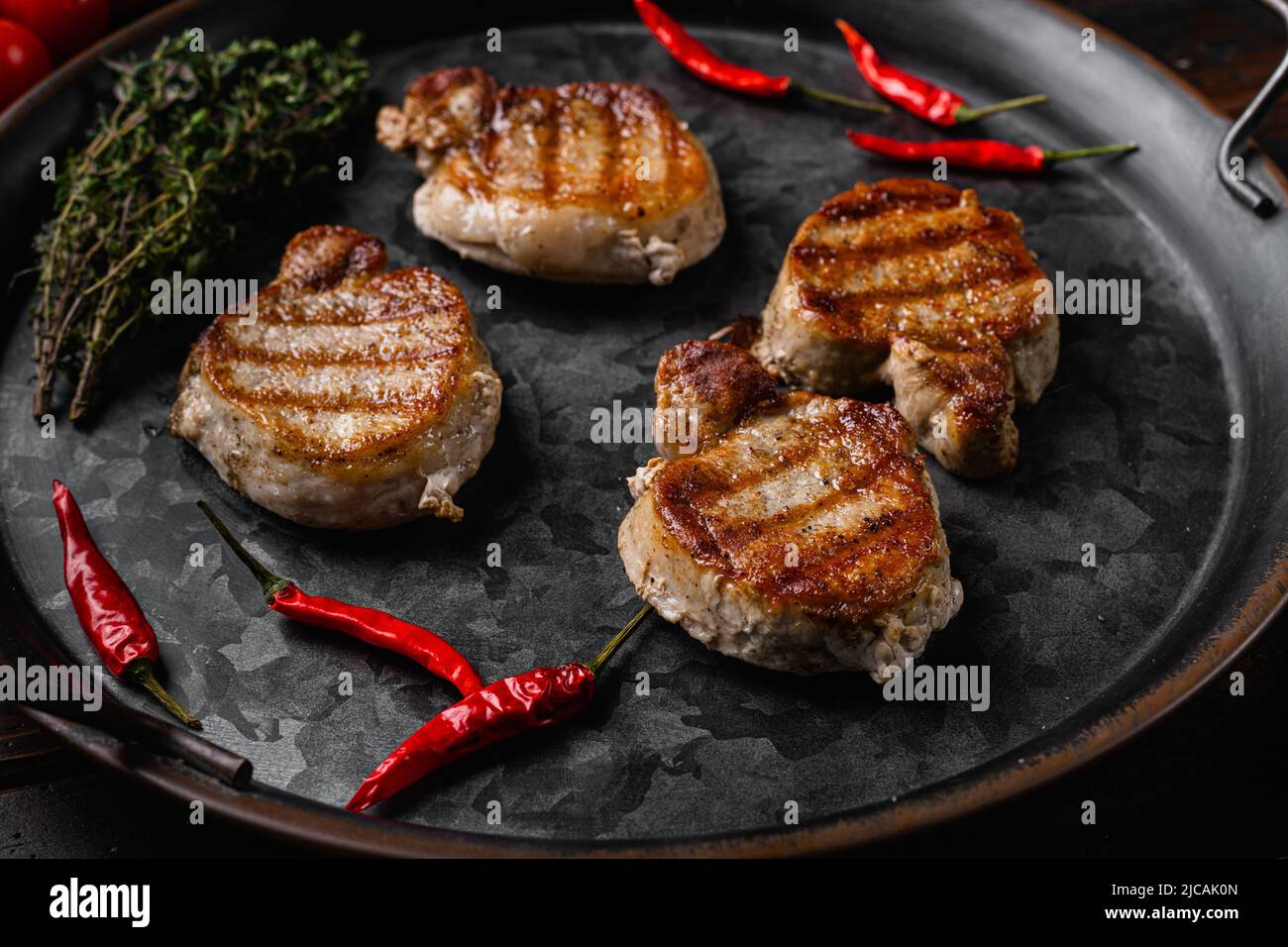 Fried pork fillet set, on black dark stone table background Stock Photo ...