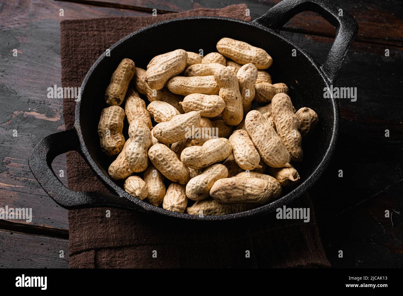 Peanut in a shell, on old dark wooden table background Stock Photo - Alamy