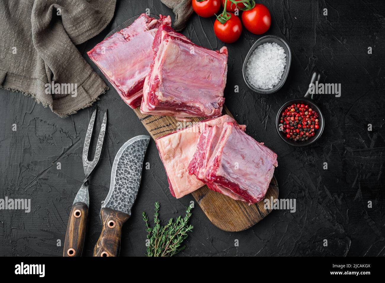 Raw Organic Beef Short Ribs Ready To Cook Set With Ingredients On Black Stone Background Top