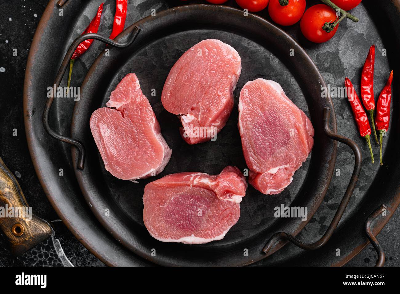 Pieces of raw pork steak with spices and herbs rosemary set, on black ...
