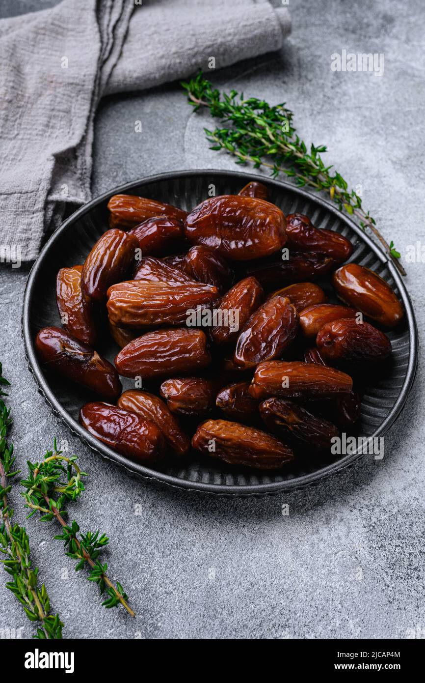 Traditional arabic dry dates set, on gray stone table background Stock ...