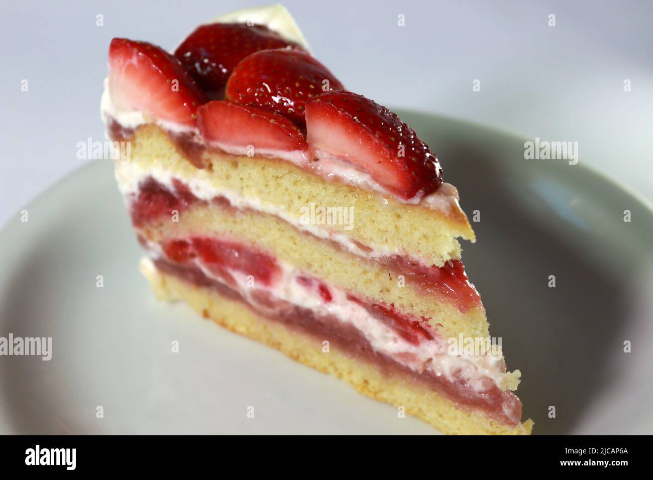 Homemade strawberry cake cut Stock Photo - Alamy
