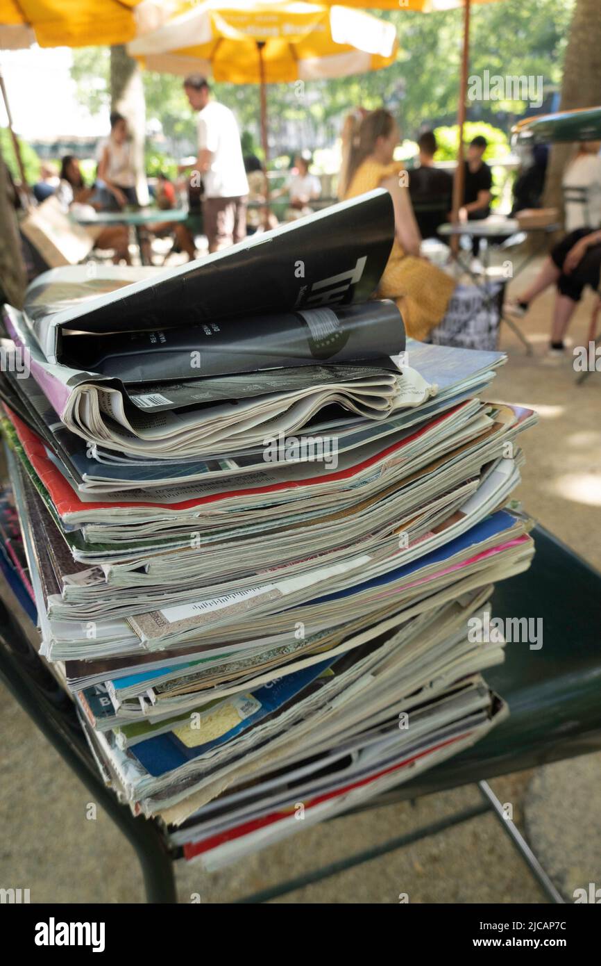Stack of reading material at the public library outdoor reading room in ...