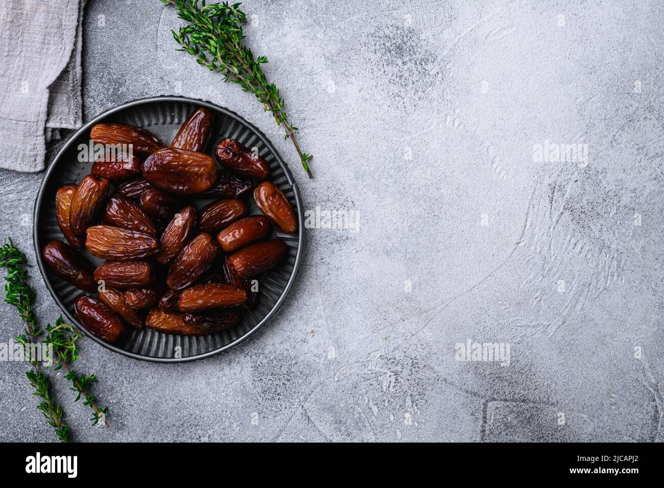 Dried date palm fruits set, on gray stone table background, top view ...