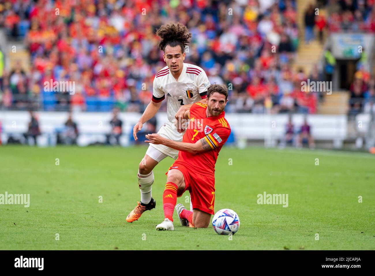 CARDIFF, UK. 11th June, 2022. Joe Allen passes from pressure from ...
