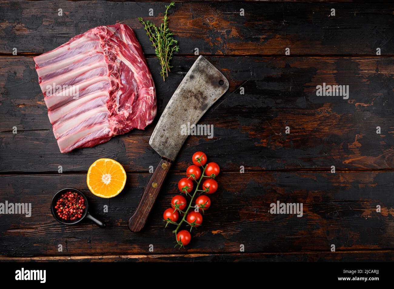 Lamb meat rib rack, on old dark wooden table background, top view flat ...