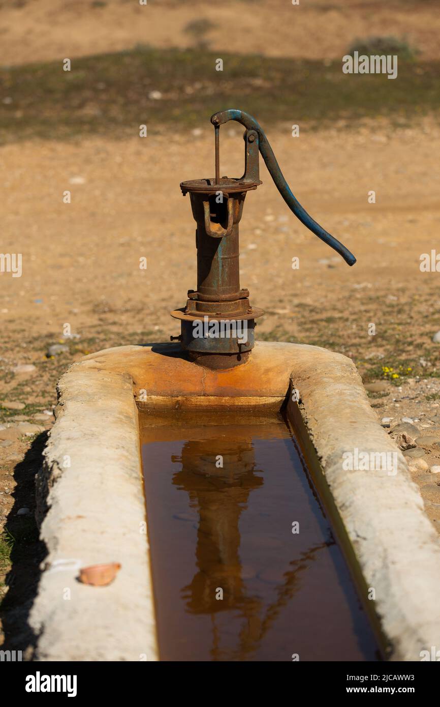 Man pumping water from vintage hi-res stock photography and images - Alamy