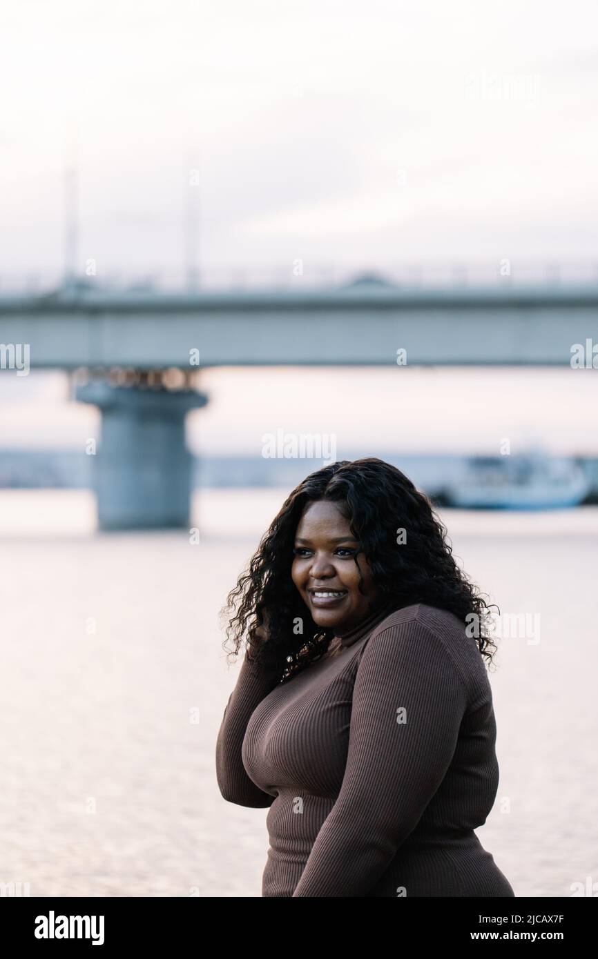 Vertical Black Haired Smiling Plump African Afro American Interracial