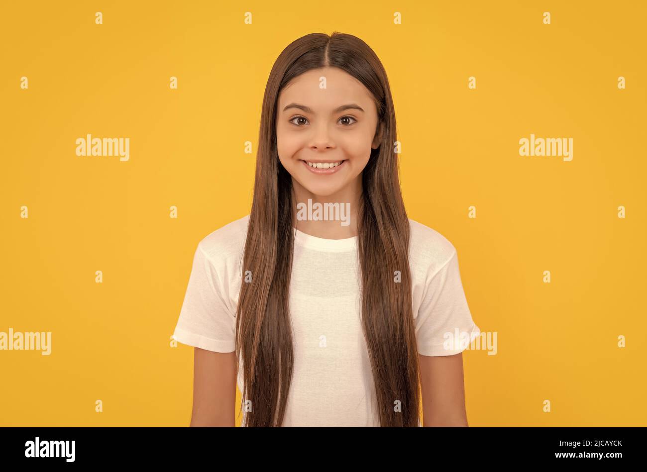 cheerful kid with long hair. beauty and fashion. female fashion model ...