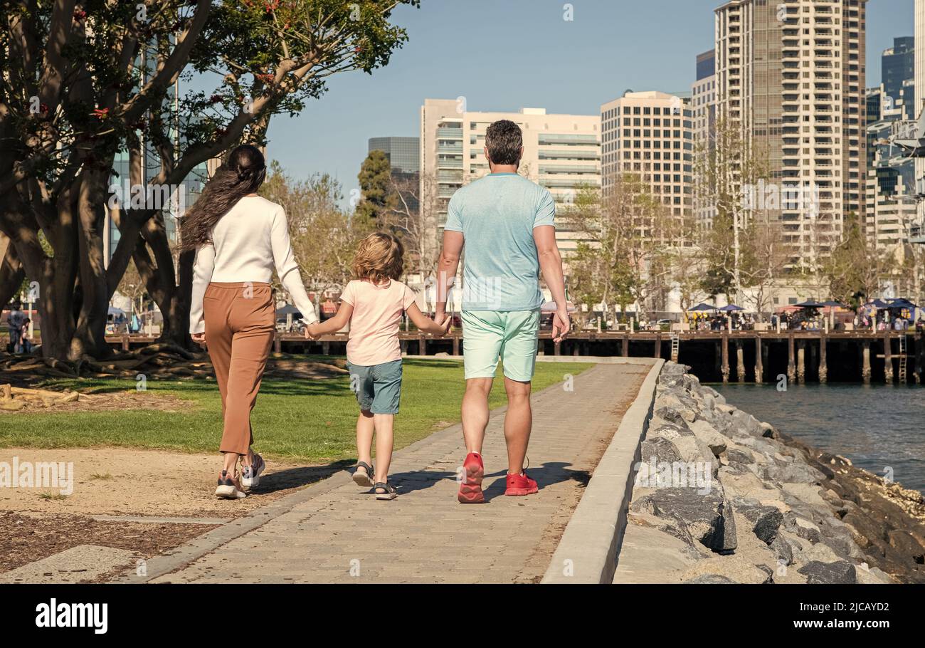 Child parents back view walking hi-res stock photography and images - Alamy