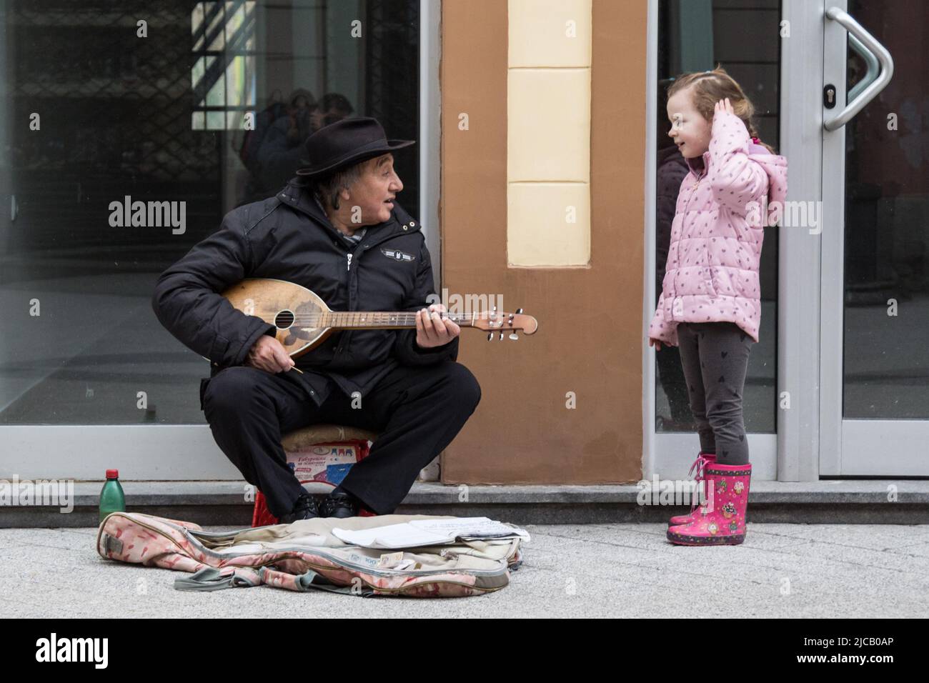 Picture of a street musician, a guitarist, playing in the streets of ...