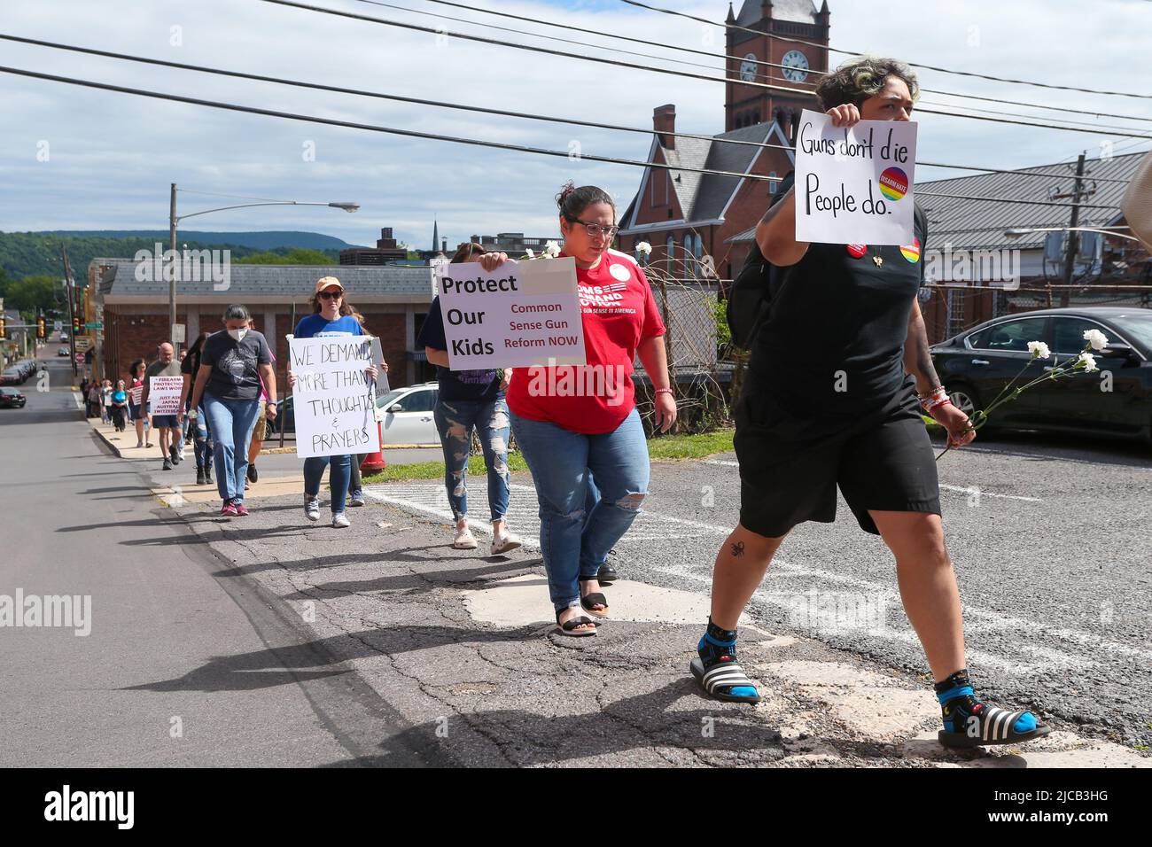 People hold signs at a March for Our Lives rally in Bloomsburg, Pa. on ...