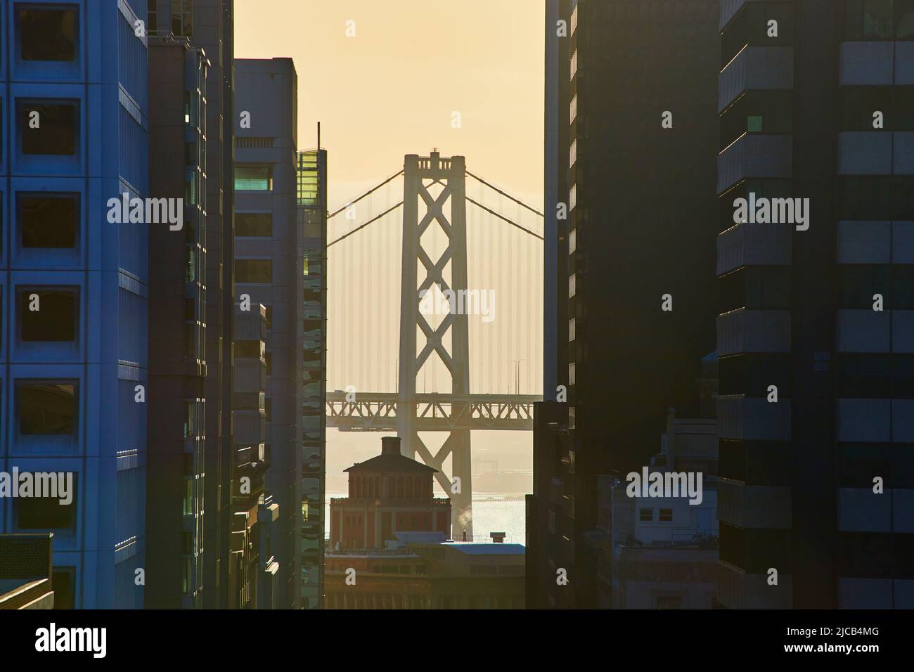 San Francisco Oakland Bay Bridge through skyscrapers Stock Photo - Alamy