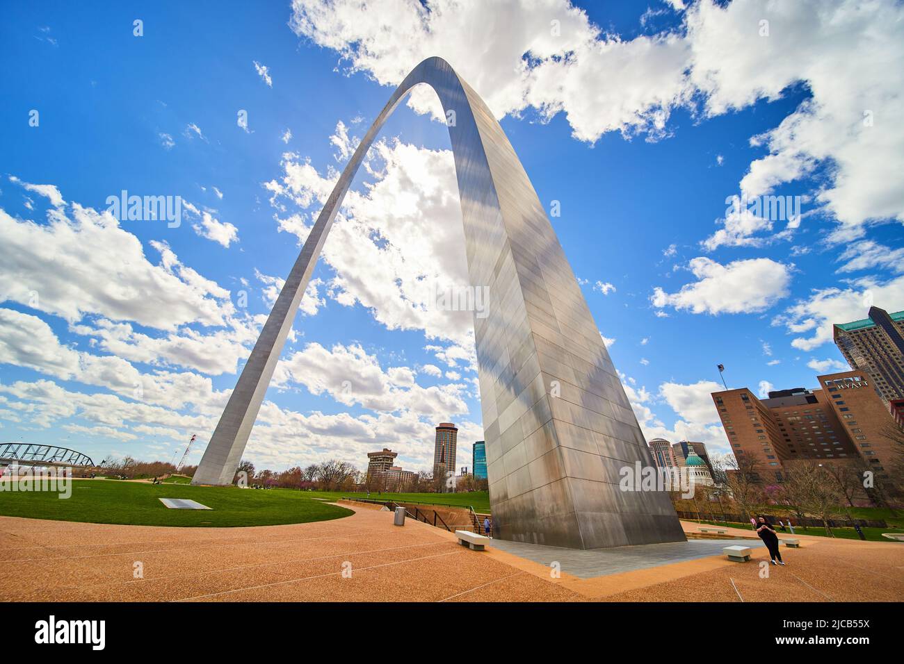 Next to Gateway Arch in St. Louis with skyline and vibrant sky Stock ...