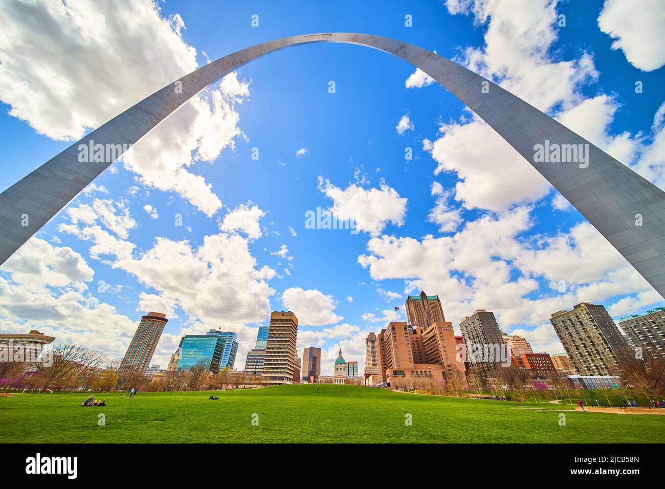 St. Louis skyline underneath the iconic Gateway Arch with blue sky ...
