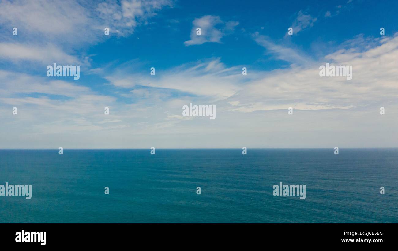 Aerial view of Blue sea with waves and sky with clouds. Ocean skyline ...