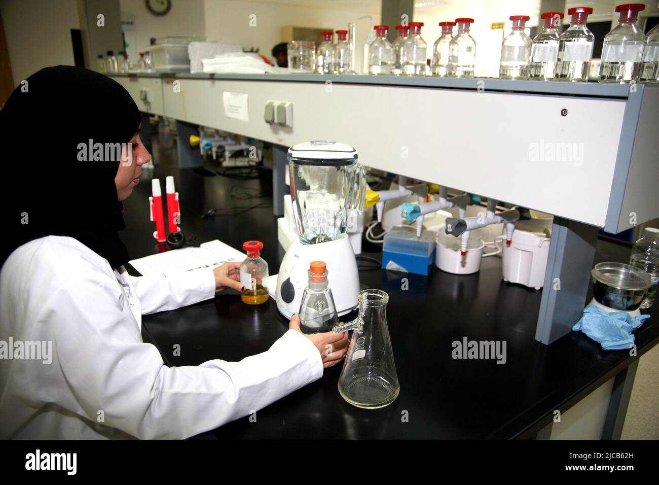 Female student in the nutrition laboratory, Institute of Health, Muscat ...