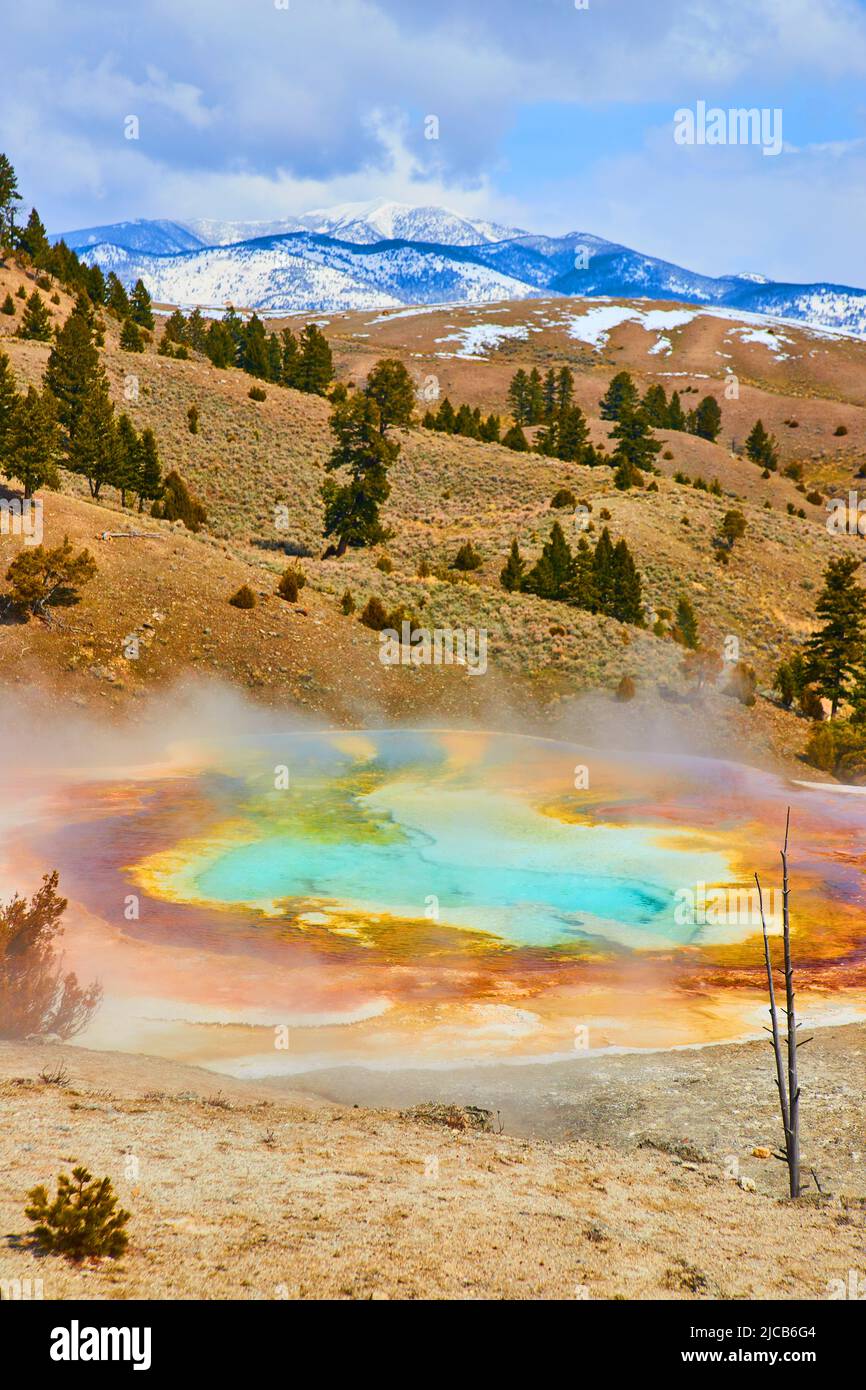 Snowy mountains with colorful gigantic hot spring at Yellowstone Stock ...