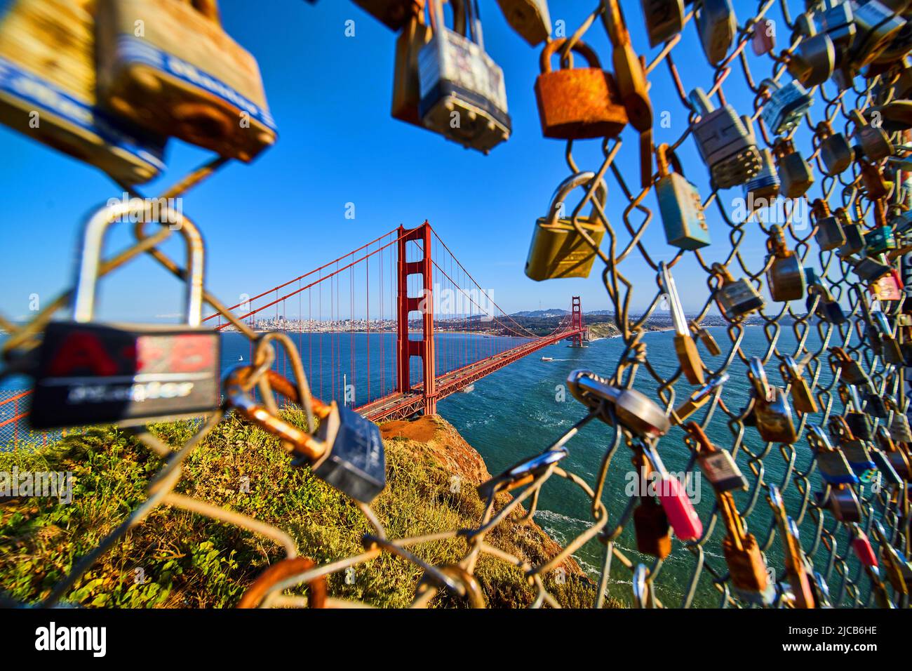 San Francisco iconic Golden Gate Bridge through opening in fence ...