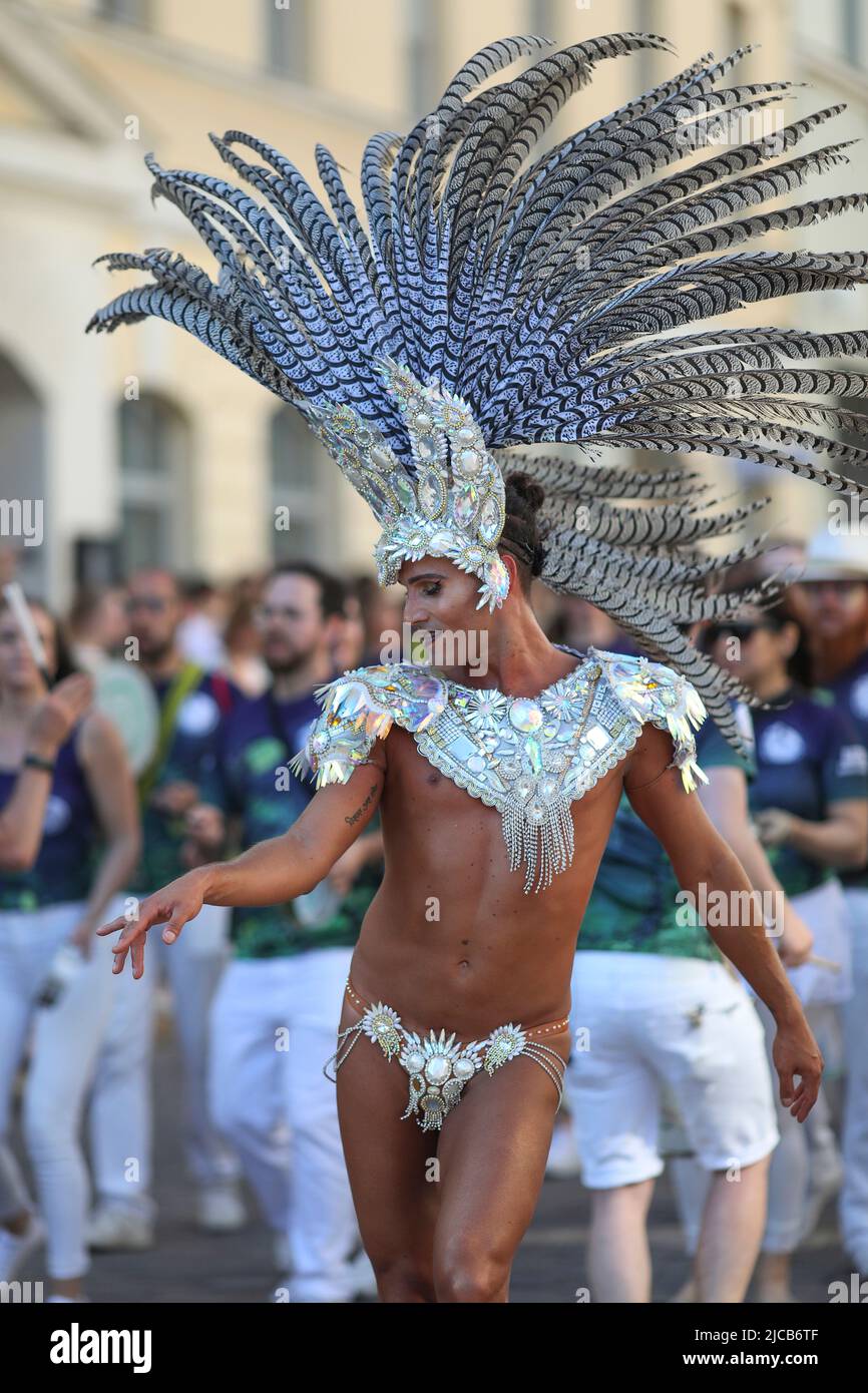 Samba performer dressed in a colorful costume dances at the Senate Square during the ...