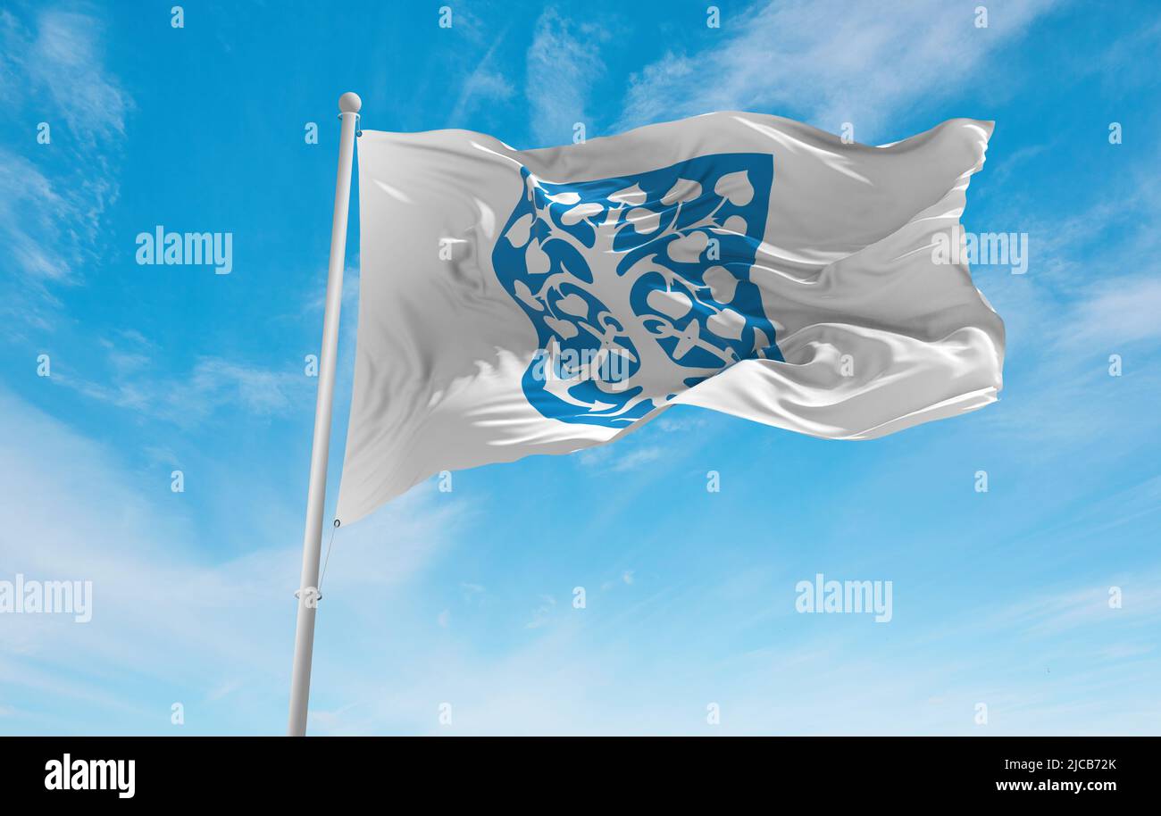 official flag of Esbjerg Kommune , Denmark at cloudy sky background on ...