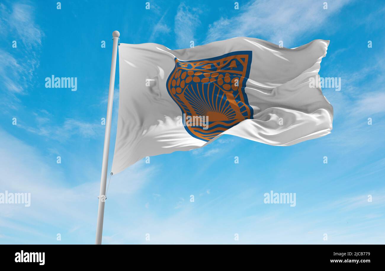 official flag of Gentofte Kommune , Denmark at cloudy sky background on ...